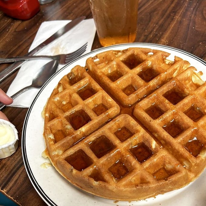 A waffle with architectural integrity that would make Frank Lloyd Wright nod in approval. Those perfect squares? Butter reservoirs by design.