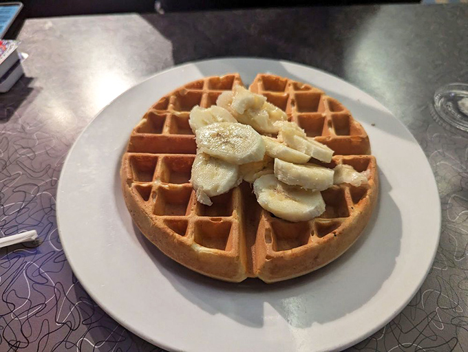 Waffles aren't just for breakfast&mdash;they're an all-day canvas for whatever toppings your heart desires. This banana-topped version is simplicity perfected.