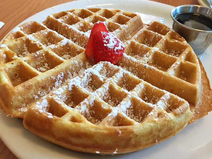 Golden waffles with perfect squares for syrup pooling &ndash; because geometry matters when breakfast is this serious.