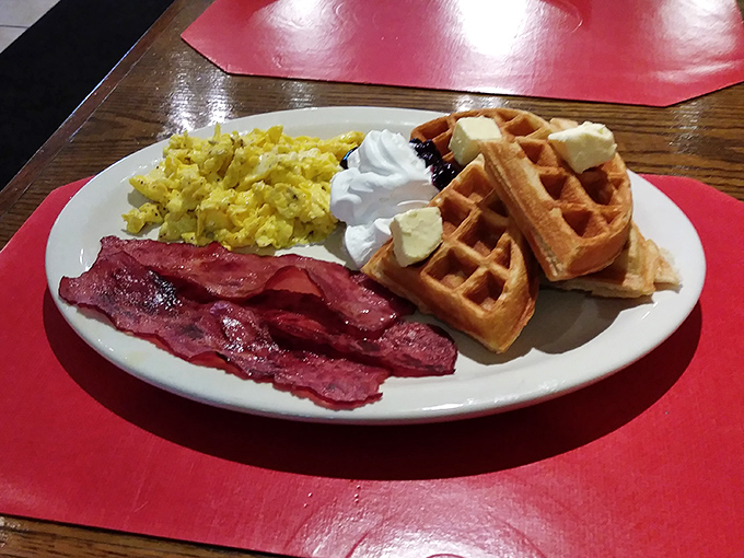 Breakfast gets a Caribbean twist with waffles, eggs, and bacon that redefine morning meal expectations.