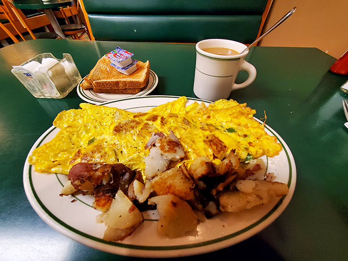 An omelet that's seen things&mdash;namely cheese, potatoes, and enough fillings to make each bite a treasure hunt of breakfast flavors. Coffee mandatory.