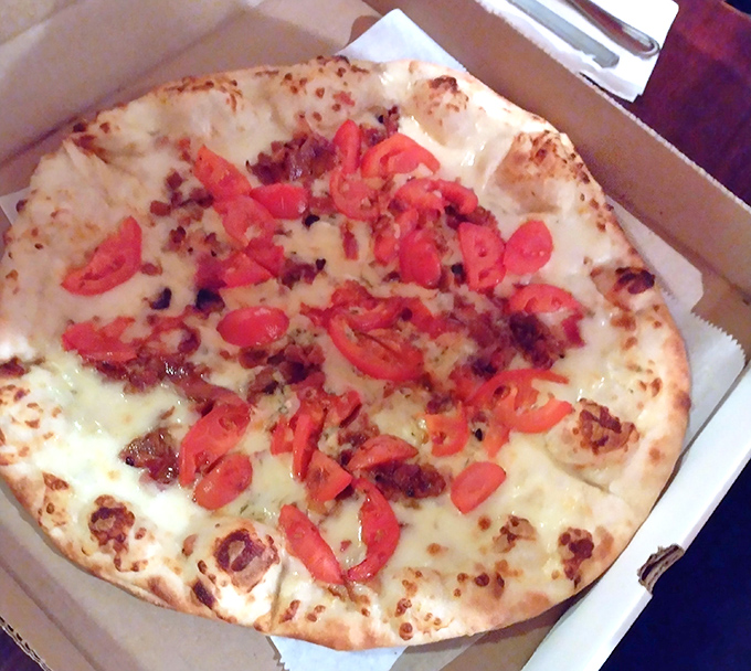 White pizza that proves cheese is indeed a food group, especially when it looks this good.