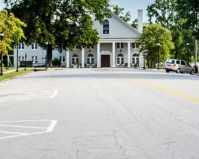 The stately white Presbyterian Church stands as both architectural centerpiece and community anchor, where generations have marked life's milestones.