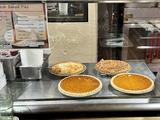 Homemade pies lined up like edible artwork&mdash;choosing just one slice becomes the most delicious dilemma of your day.