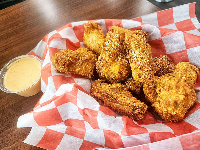 Golden-brown chicken tenders that shatter with each bite, served with a dipping sauce that's their perfect dance partner. Crispy on the outside, juicy within &ndash; nature's perfect design.