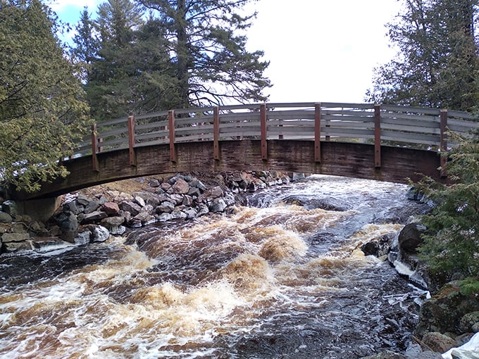 This rustic bridge seems to say, "Cross me if you dare!" The churning waters below provide nature's own surround sound system.