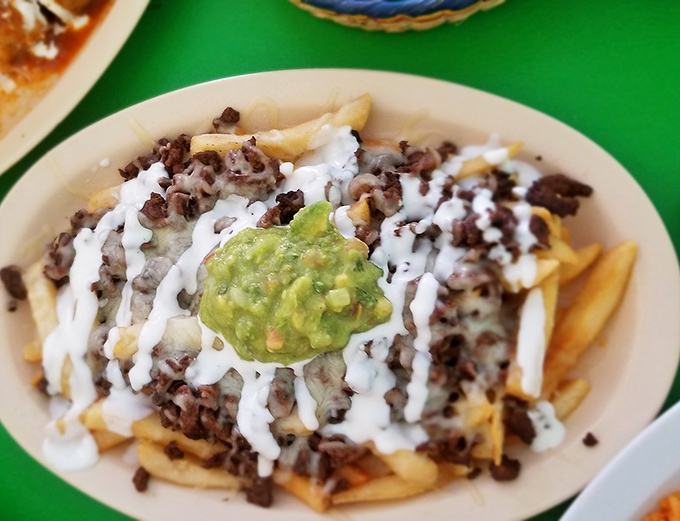 Carne asada fries: where French cuisine meets Mexican street food in a beautiful collision that your diet plan never saw coming.