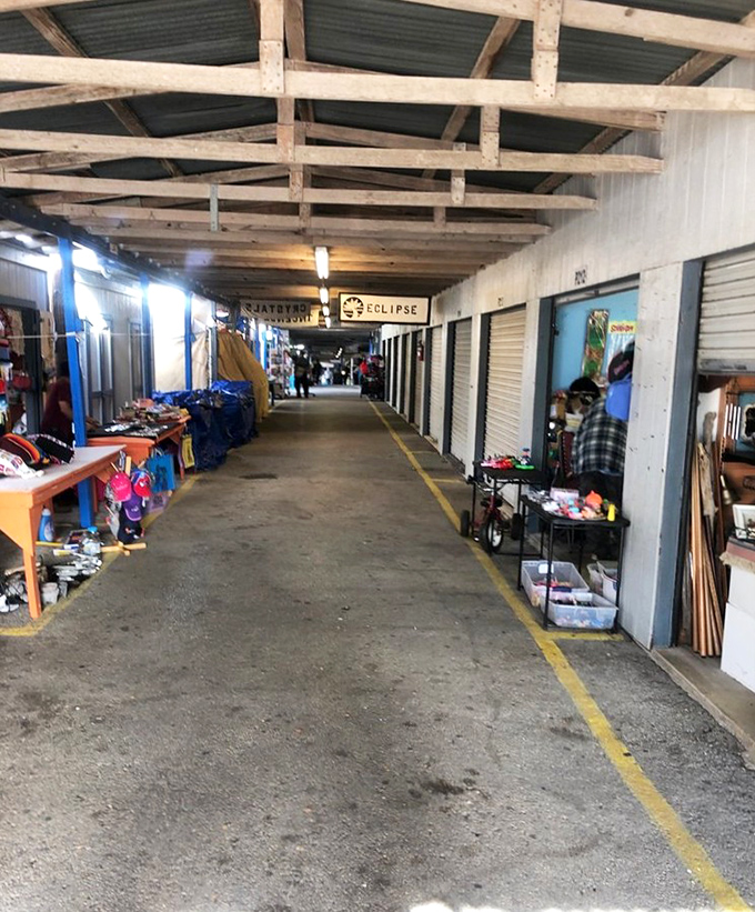 Weathered beams and roll-up doors create a no-frills shopping cathedral where the faithful gather to worship at the altar of secondhand treasures.