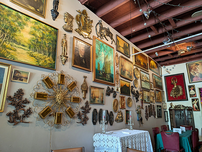Not just a wall of art&mdash;it's a conversation starter. "Is that a gold sunburst next to Victorian portraits?" Yes, and somehow it works beautifully.