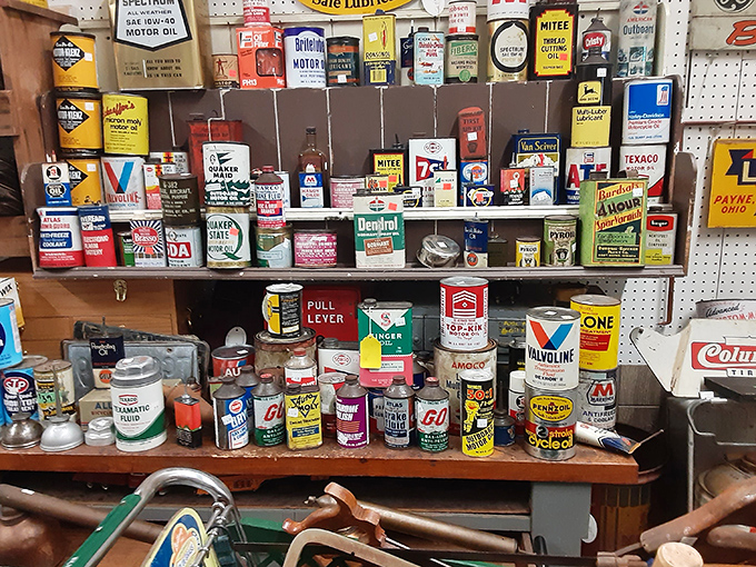 Remember when motor oil came in these colorful cans? This collection of vintage automotive products looks like a 1950s service station exploded in the best possible way.