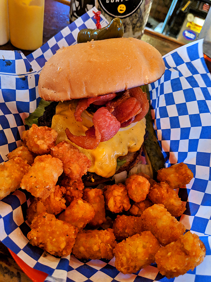 A burger that requires both hands and a strategy. The bacon's not just a topping&mdash;it's a declaration of delicious intent.