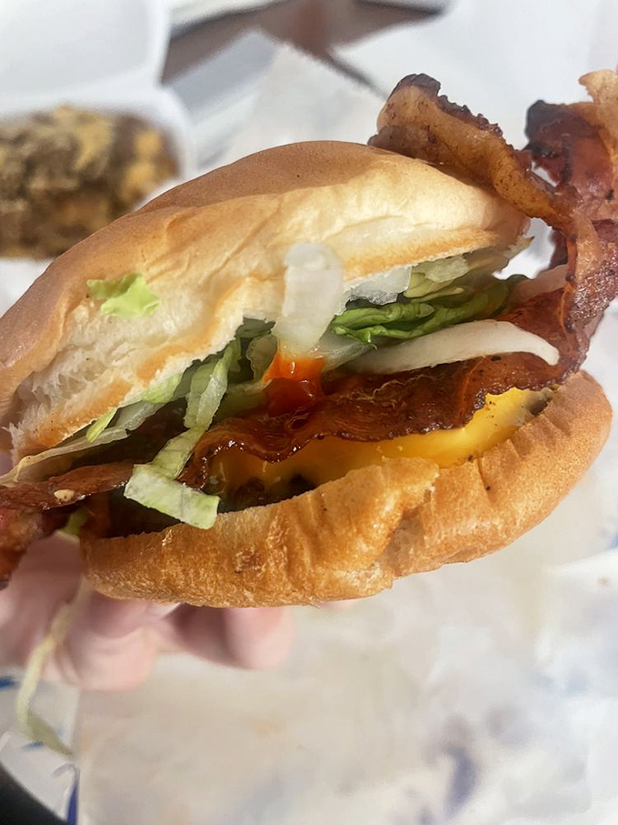 The classic bacon cheeseburger, elevated to art form. Fresh lettuce and tomato add color to this masterpiece of American cuisine.