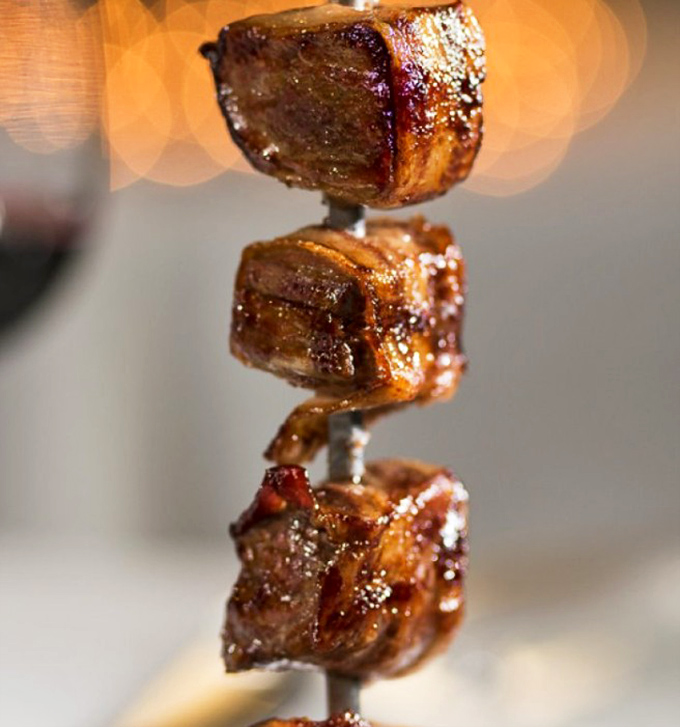 Bacon-wrapped anything is good, but bacon-wrapped filet mignon is proof that someone up there loves us and wants us to be happy.