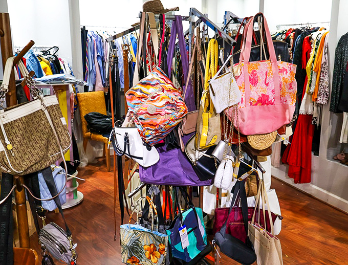 Handbag heaven! Designer dreams and colorful carryalls hanging like exotic fruit, waiting to be plucked by savvy shoppers.