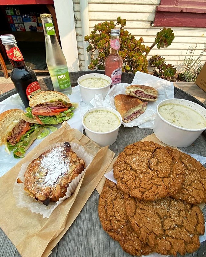 A feast fit for coastal royalty&mdash;sandwiches, soups, and cookies arranged on a barrel table with the Pacific providing the perfect backdrop.