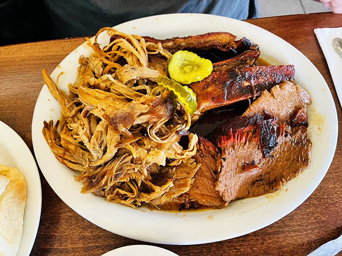 The barbecue equivalent of a greatest hits album—pulled pork, brisket, and ribs sharing a plate like the supergroup they were meant to be.