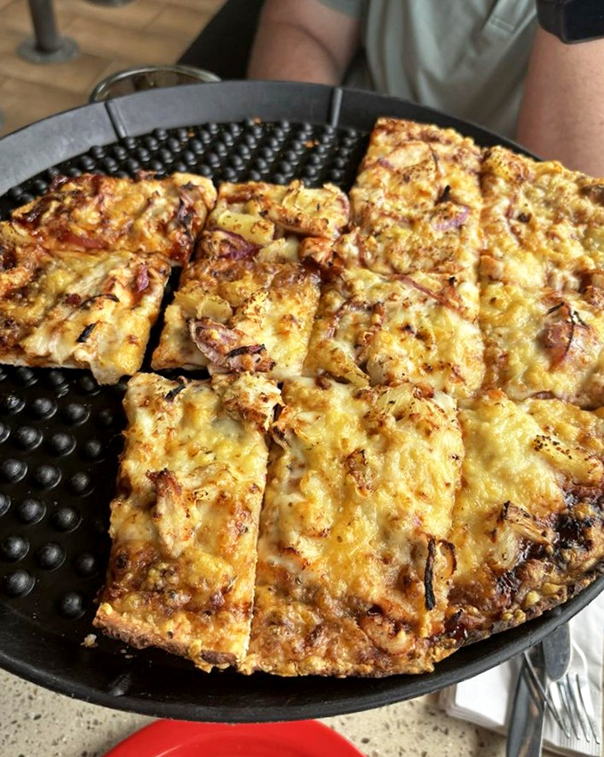 BBQ chicken pizza that makes you question your pizza loyalties. The kind of pie that haunts your dreams in the best way.