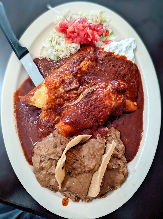 These enchiladas aren't messing around. The sauce-to-plate ratio suggests someone in the kitchen believes in generosity as a virtue.