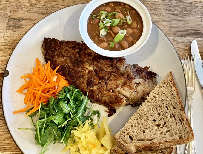 When breakfast meets lunch and they fall madly in love &ndash; a hearty plate featuring perfectly seasoned hash, fresh vegetables, and bread substantial enough to sop up every last morsel.