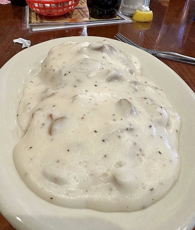 What looks like a cloud but tastes like heaven? This plate of biscuits smothered in creamy gravy &ndash; the ultimate Southern comfort.