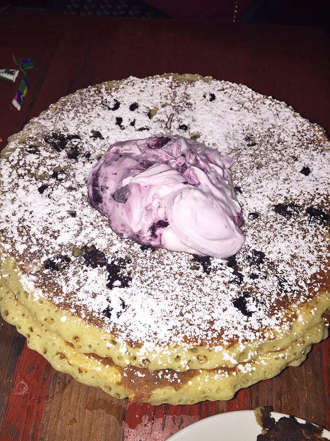 This blueberry pancake masterpiece looks like it should have its own Instagram account. That purple-swirled cream center is practically posing for the camera.