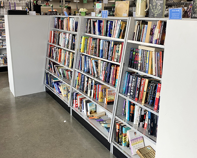 The book section rivals small libraries, offering literary journeys for pocket change. Cookbooks, mysteries, and self-help gurus all sharing shelf space.