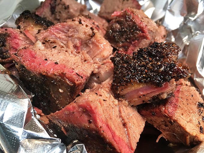 Brisket sliced thick enough to showcase that coveted pink smoke ring like a barbecue hall of fame.