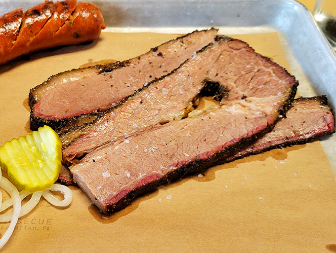 Sliced brisket with the perfect pink smoke ring &ndash; proof that patience isn't just a virtue, it's a requirement for barbecue greatness.
