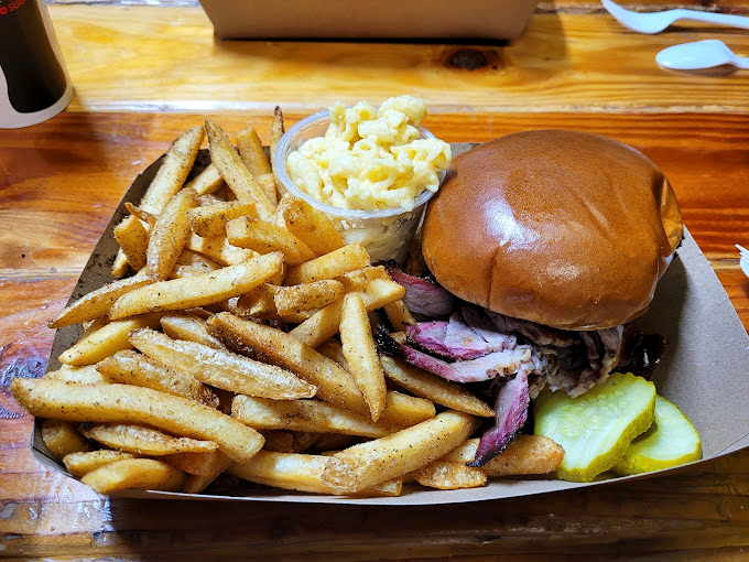 This isn't just a sandwich; it's a brisket revelation on a bun. The pickle slice isn't garnish&mdash;it's the perfect acidic counterpoint to smoky richness.