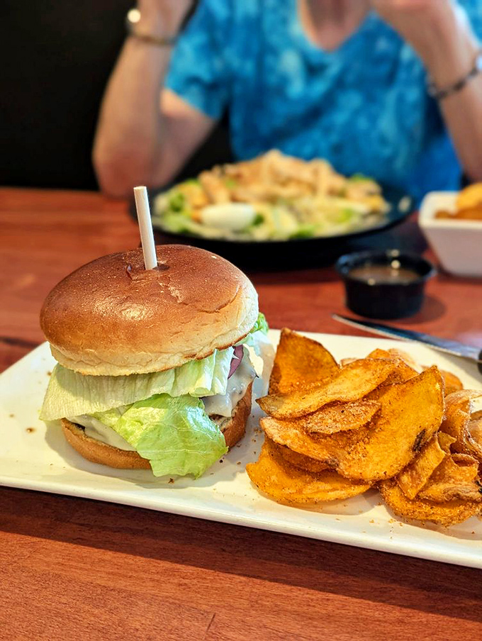 A burger that stands tall without showboating. Those house-made chips on the side are the unsung heroes of this plate.