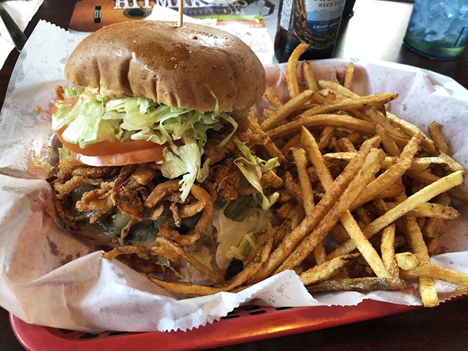 A burger that requires both hands and a strategy. Those crispy onion straws aren't just toppings—they're a textural revelation.