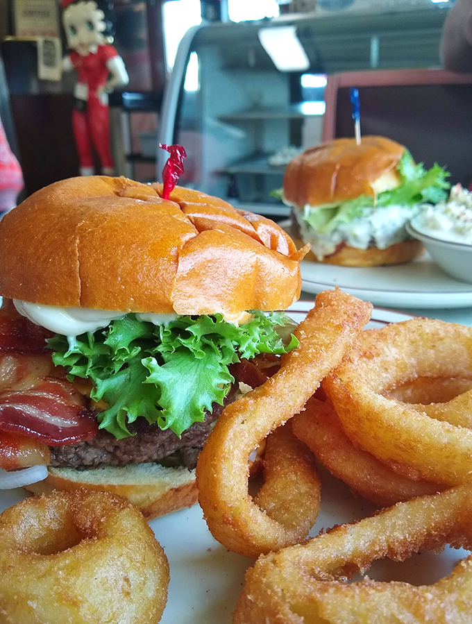 Burger artistry that puts fancy $20 downtown versions to shame. Those onion rings aren't just sides&mdash;they're halos of happiness.