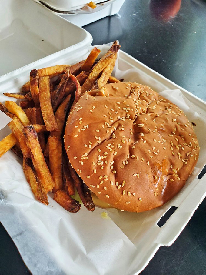 The classic combo that launched a thousand road trips: a perfectly proportioned burger and hand-cut fries in their natural habitat.