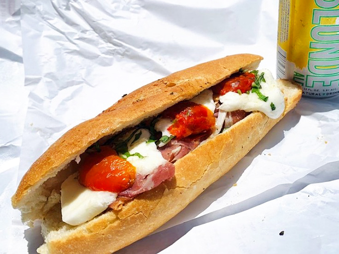 The legendary Burrata Caprese in its natural habitat &ndash; simple ingredients transformed into sandwich perfection that speaks fluent Italian.