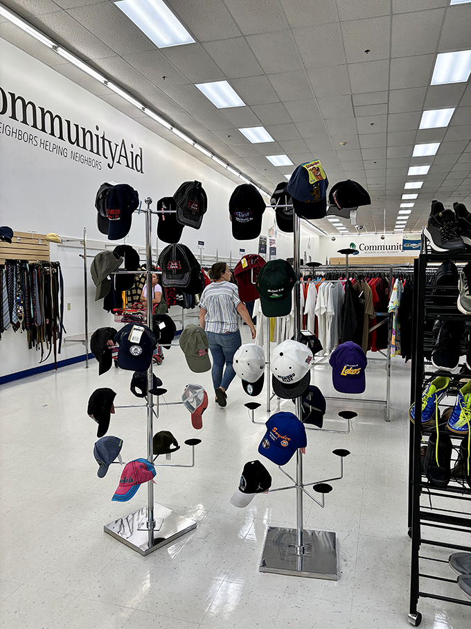A forest of baseball caps telling stories of allegiances, vacations, and that 5K someone ran once and never again.