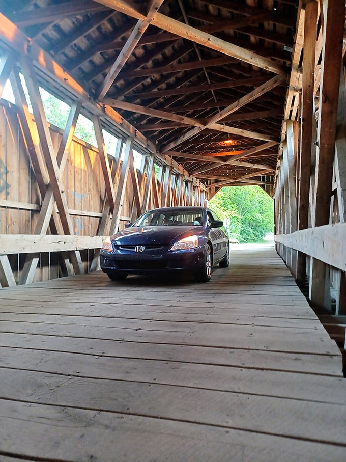 Slower than a walk isn't just a quaint suggestion&mdash;it's the law! This Honda driver follows rules established when horses pulled carriages through these same wooden corridors.