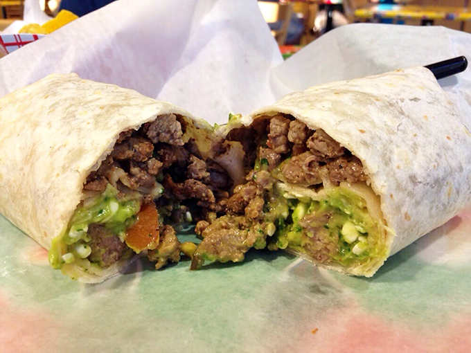 The carne asada burrito cross-section reveals layers of happiness wrapped in tortilla engineering genius.