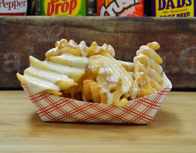 Waffle fries wearing a melted cheese blanket&mdash;because regular fries just don't dress up for special occasions.