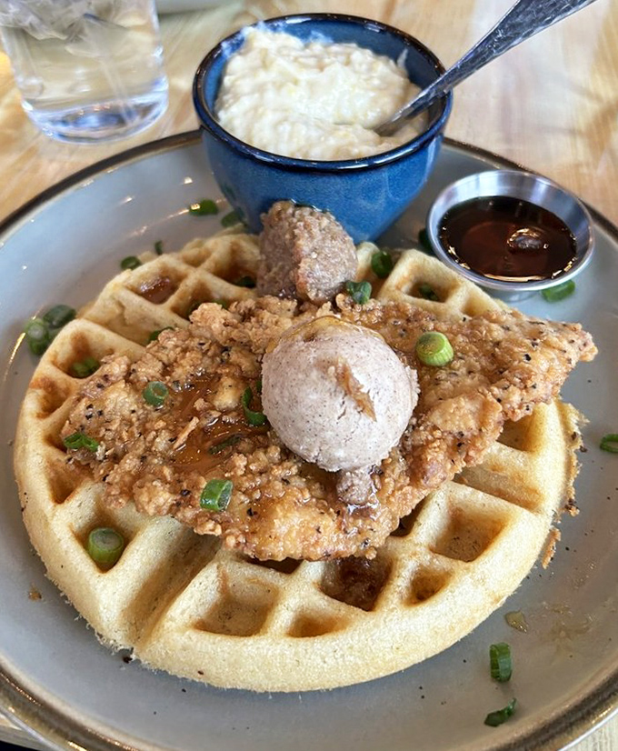 Chicken and waffles reimagined with seafood sensibility. The crispy chicken perches atop a golden waffle like it's found its forever home.