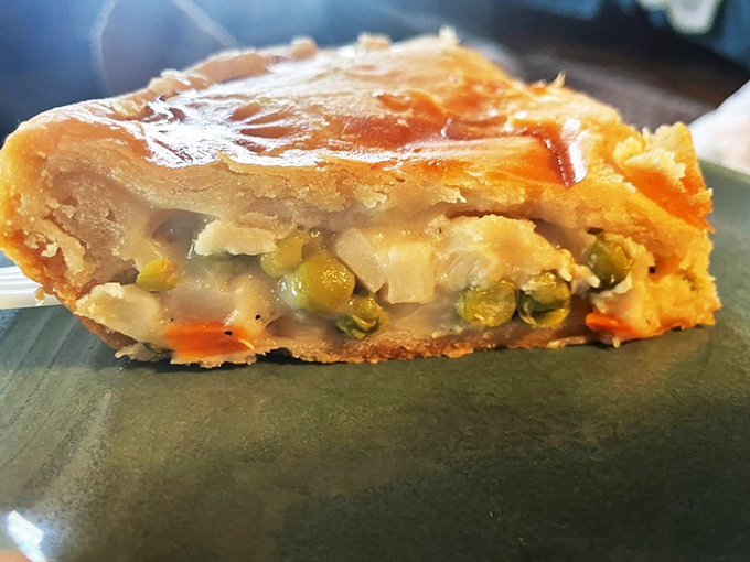 Pot pie perfection that would make your grandmother both proud and jealous. The golden crust barely contains its savory secrets, like a delicious treasure chest.