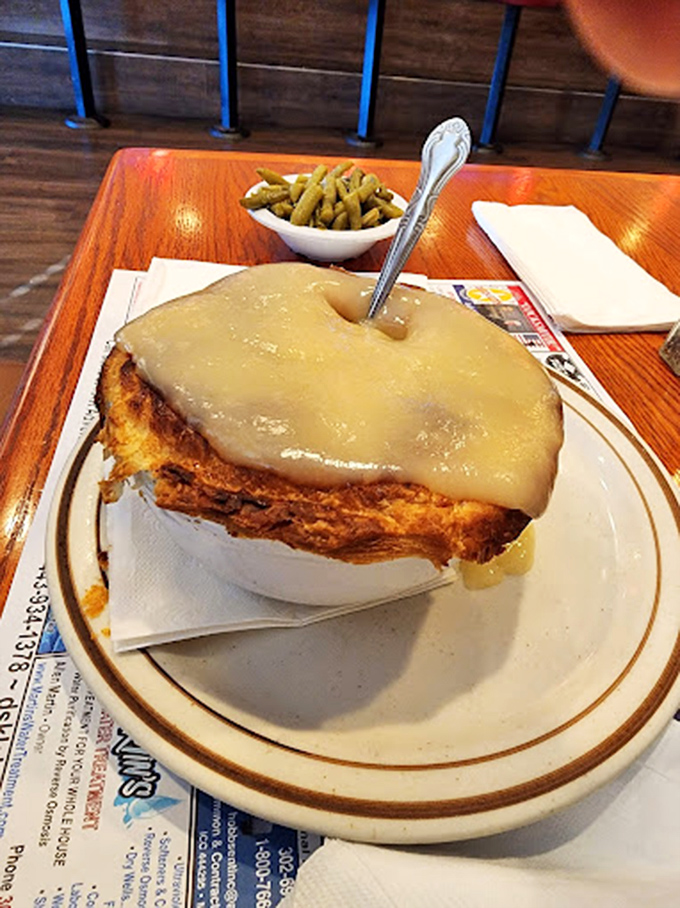 Chicken pot pie that rises to magnificent heights, draped in gravy that could make a vegetarian reconsider their life choices.