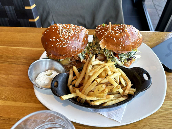 These aren't just sandwiches; they're architectural masterpieces with sesame-studded buns and golden fries that would make any cardiologist nervously clear their throat.