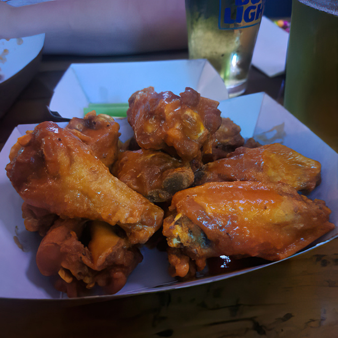 Wings glistening with sauce that promises to leave its mark on both your taste buds and possibly your shirt&mdash;a delicious risk worth taking.