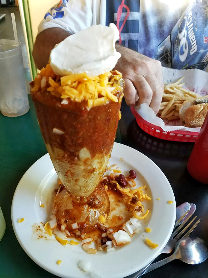 Behold the chili&mdash;standing tall in its edible bread bowl fortress, crowned with cheese and onions like the royalty of comfort food it truly is.