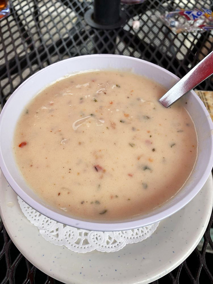 The legendary chowder arrives like a creamy ocean in a bowl. Each spoonful is a maritime expedition of flavor.