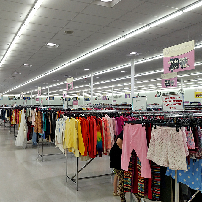 The women's clothing section stretches toward the horizon, a color-coded rainbow of possibilities organized with surprising military precision.