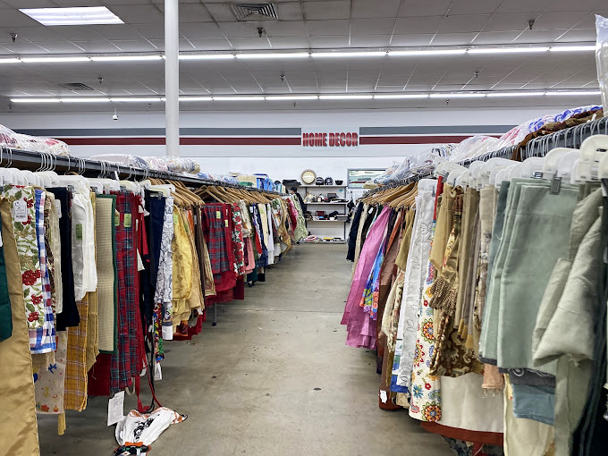 The fabric time machine &ndash; where vintage tablecloths and curtains hang like colorful ghosts of home d&eacute;cor past.