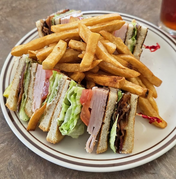 The club sandwich&mdash;three stories of deliciousness with fries as the perfect neighbors. No avocado toast in sight!