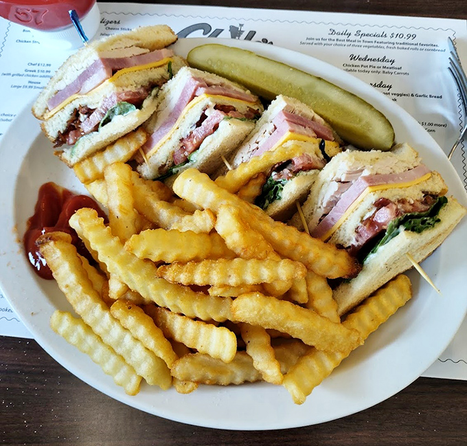 The club sandwich&mdash;mankind's greatest achievement after fire and the wheel. Perfectly stacked, precisely cut, with fries that could make a French chef weep.
