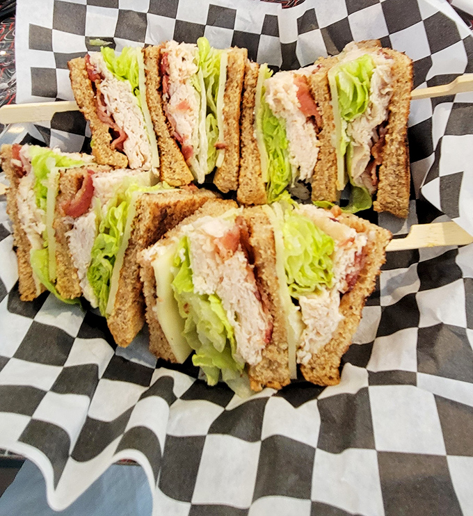 The club sandwich&mdash;stacked higher than my hopes for dessert. Each layer tells its own delicious story.